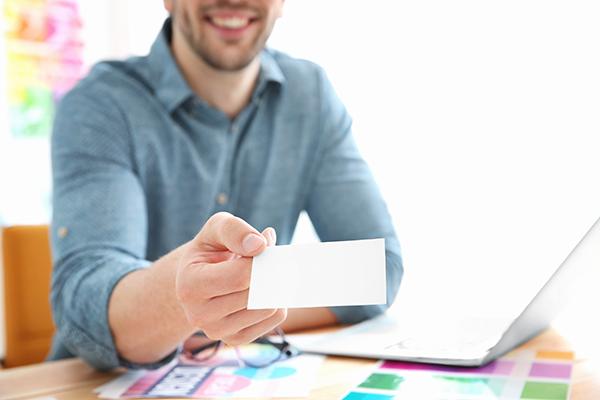 Handing Out Business Card To Someone